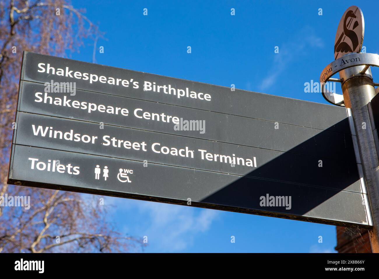A signpost in the historic town of Stratford-Upon-Avon in the UK ...