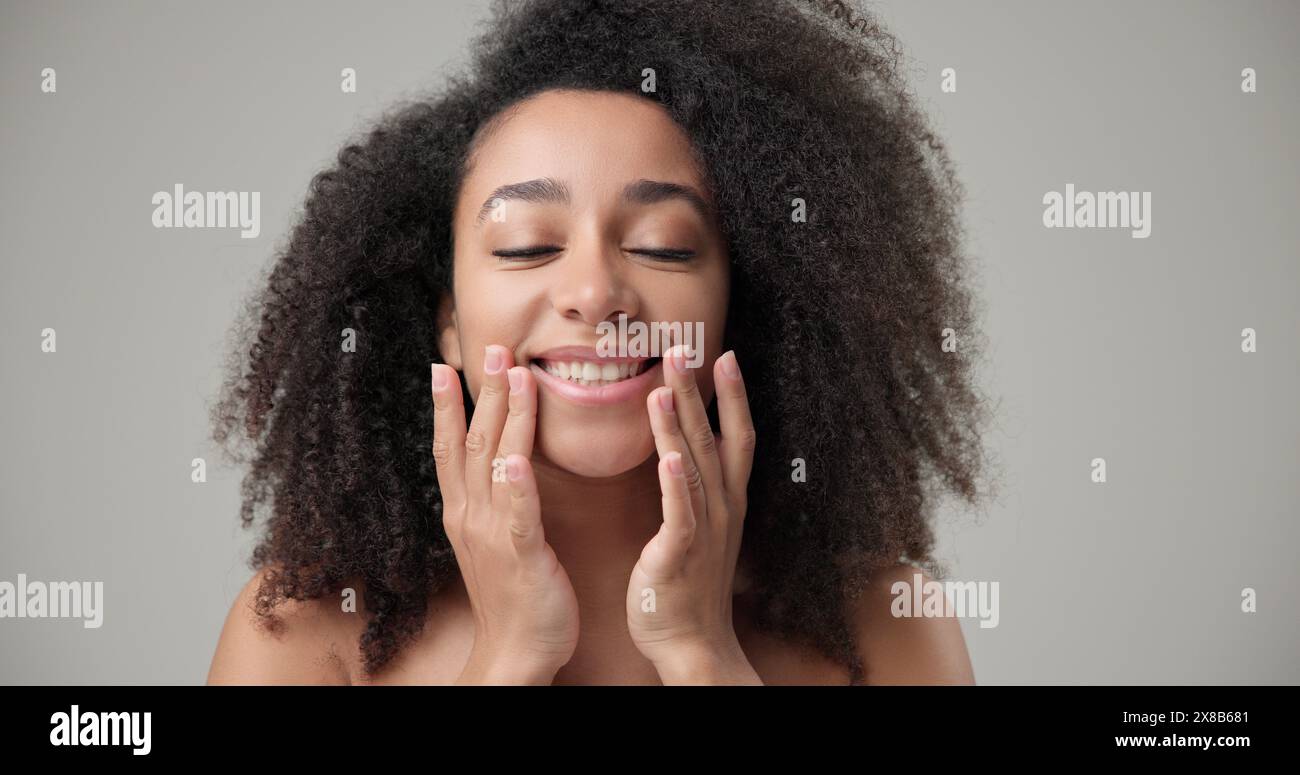 Beauty and healthcare concept - beautiful African American woman with ...