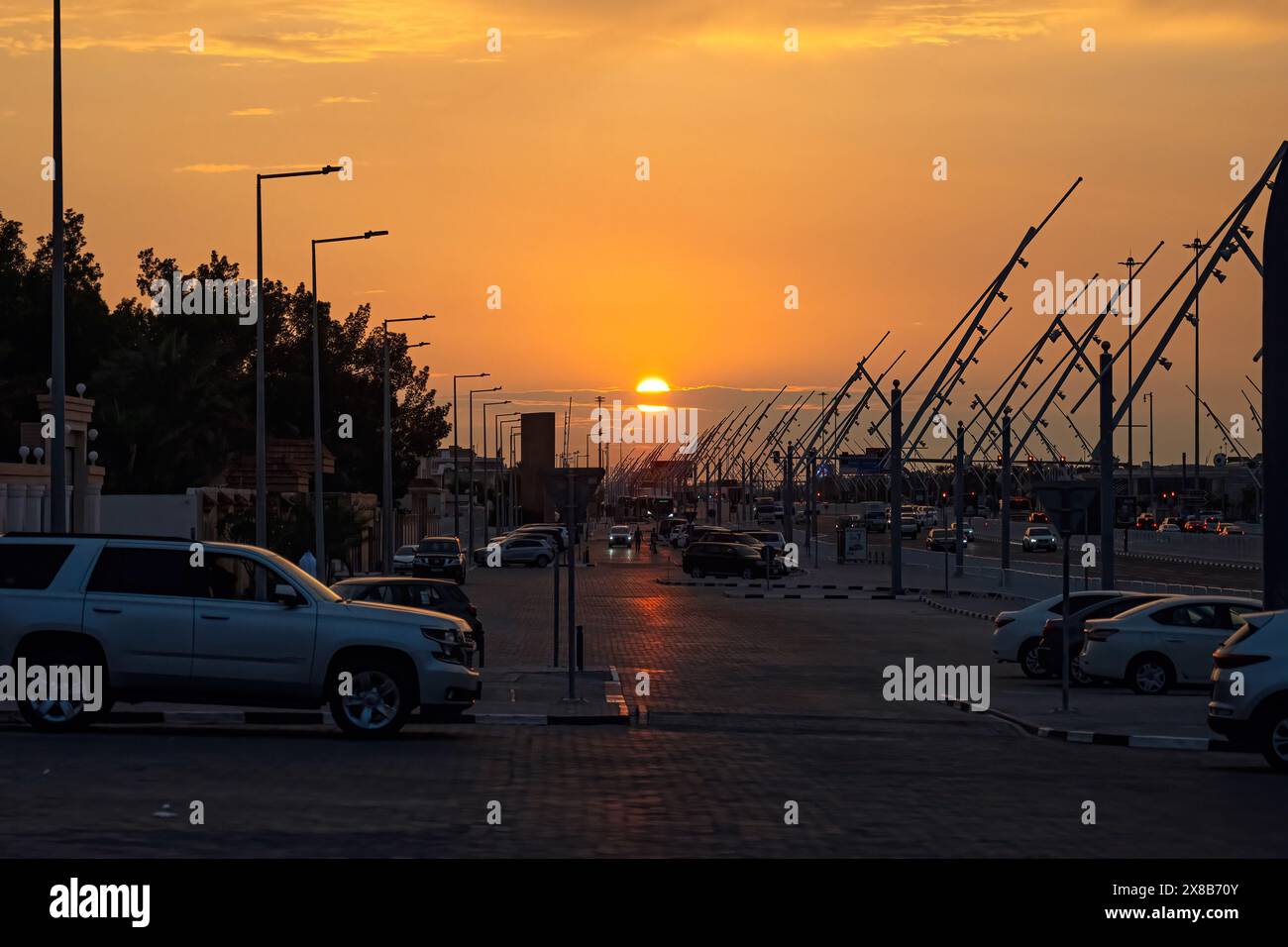 Doha Roads and traffic light trail at sunset time. Sunset view Al Waab ...