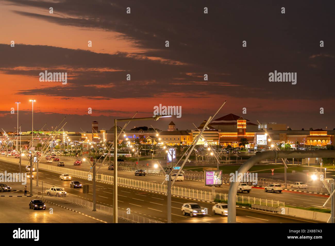 Doha Roads and traffic light trail at sunset time. Sunset view Al Waab ...