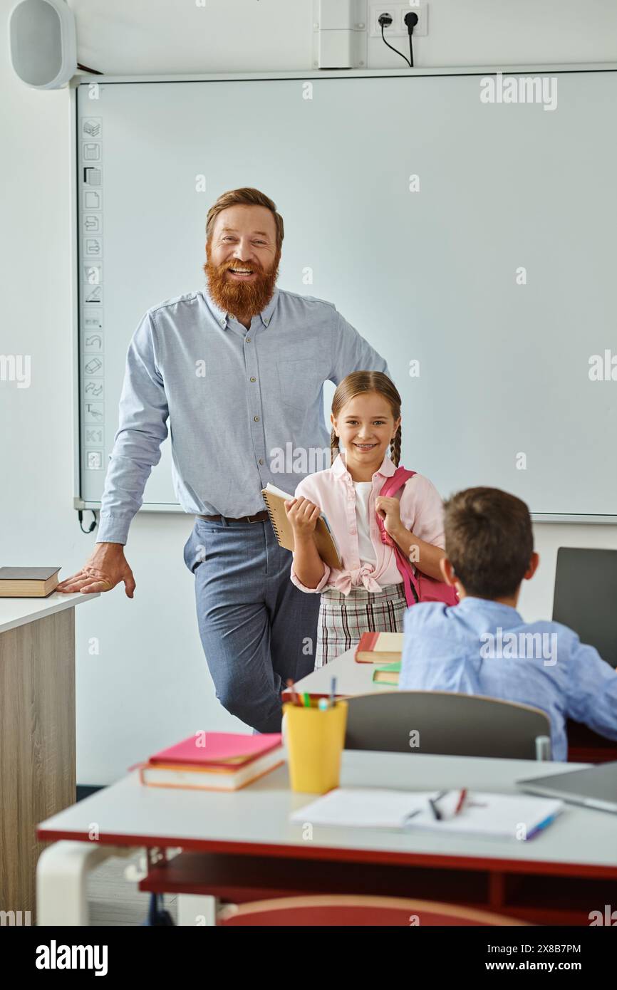 A man stands in front of a whiteboard, instructing a little girl in a ...
