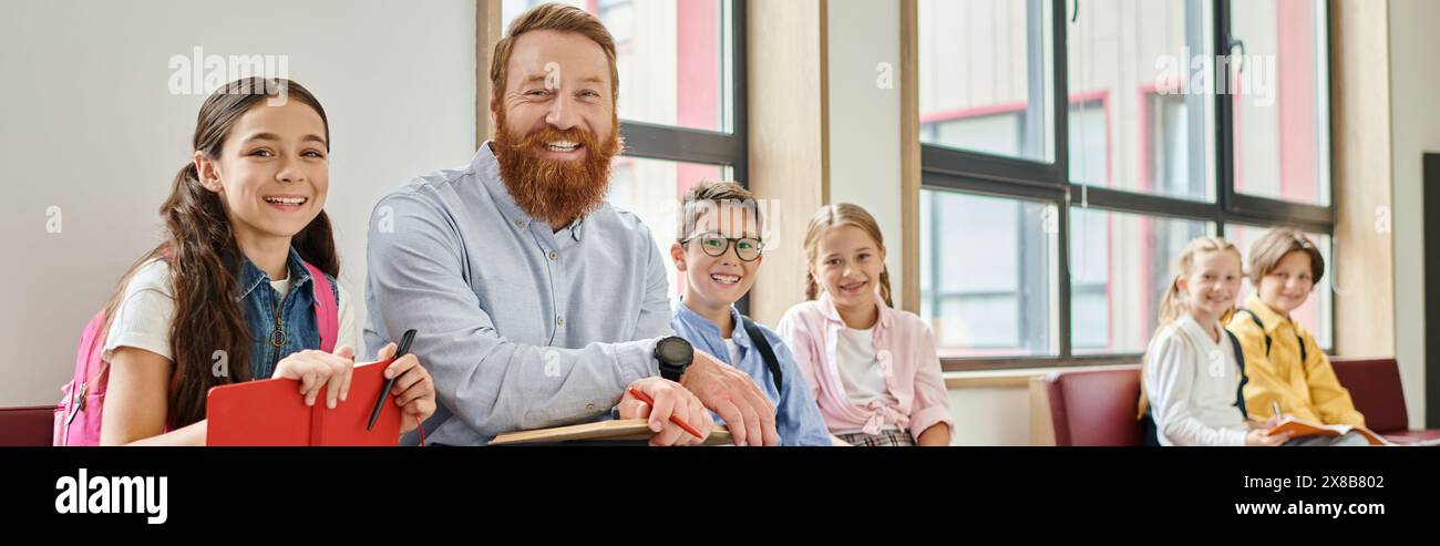 A male teacher instructs a group of diverse kids in a bright, lively ...