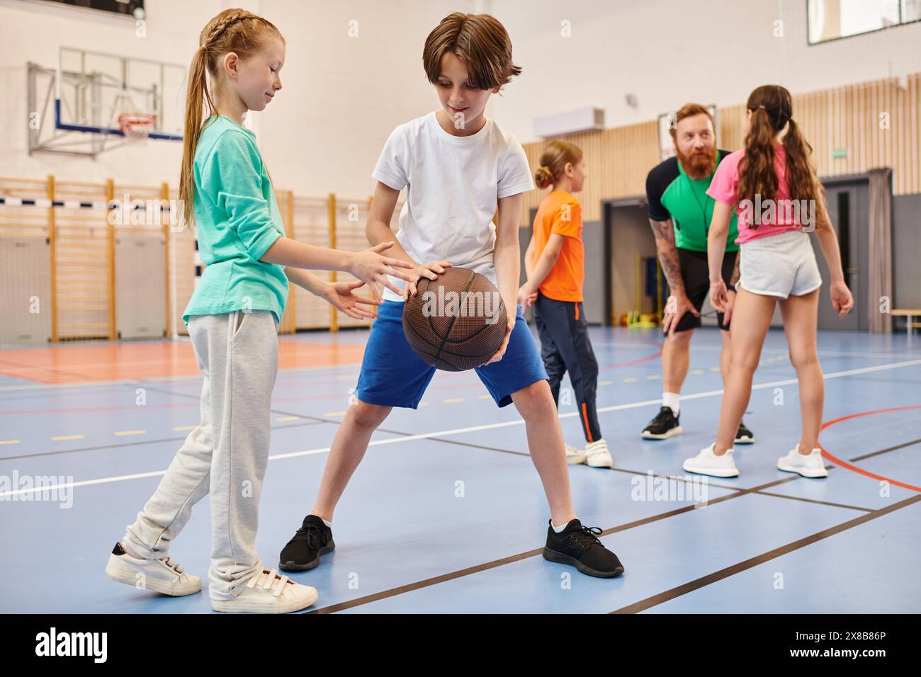 Children playing basketball team hi-res stock photography and images ...