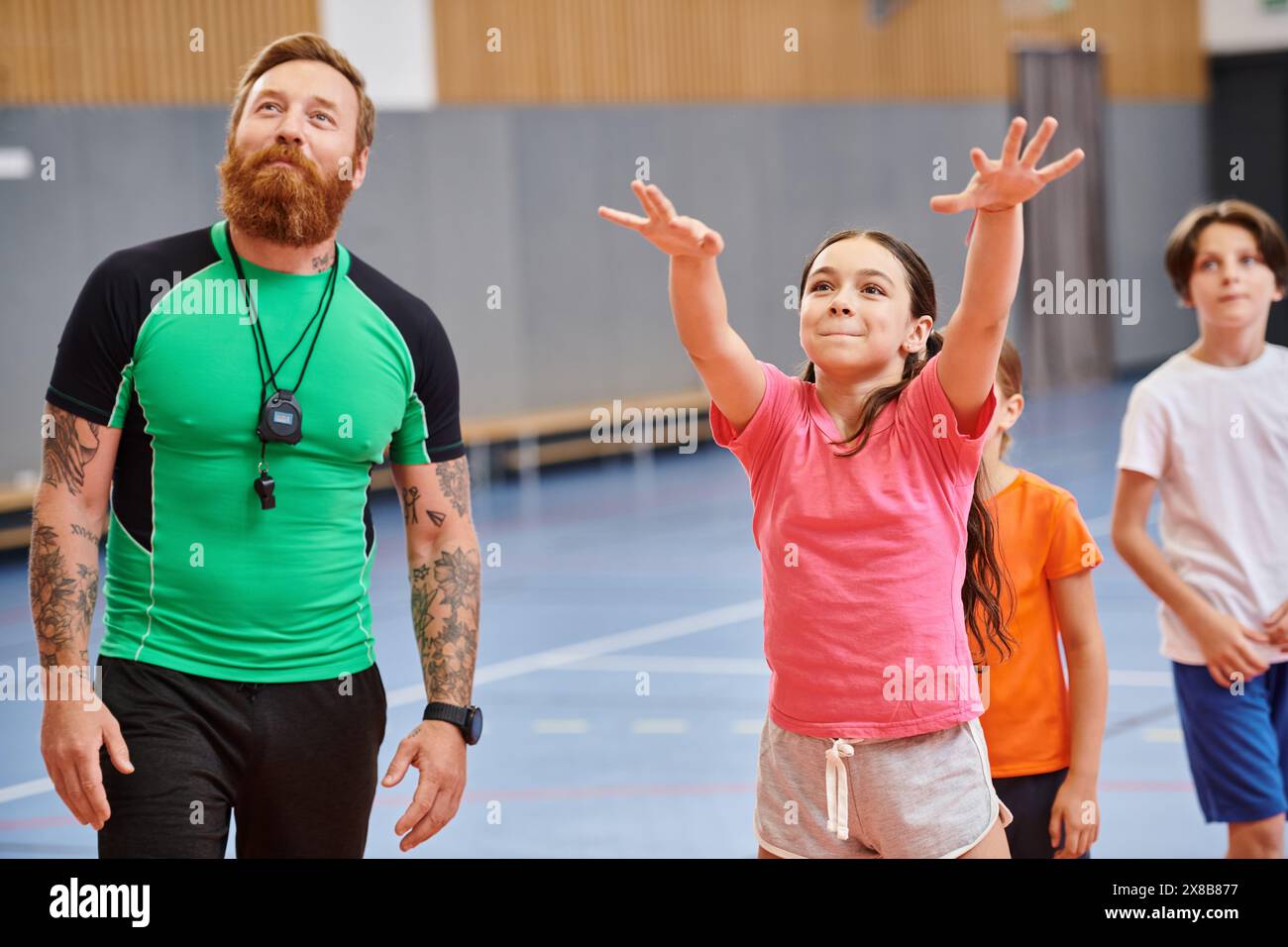 kids and teacher in school gym, playing basketball Stock Photo - Alamy