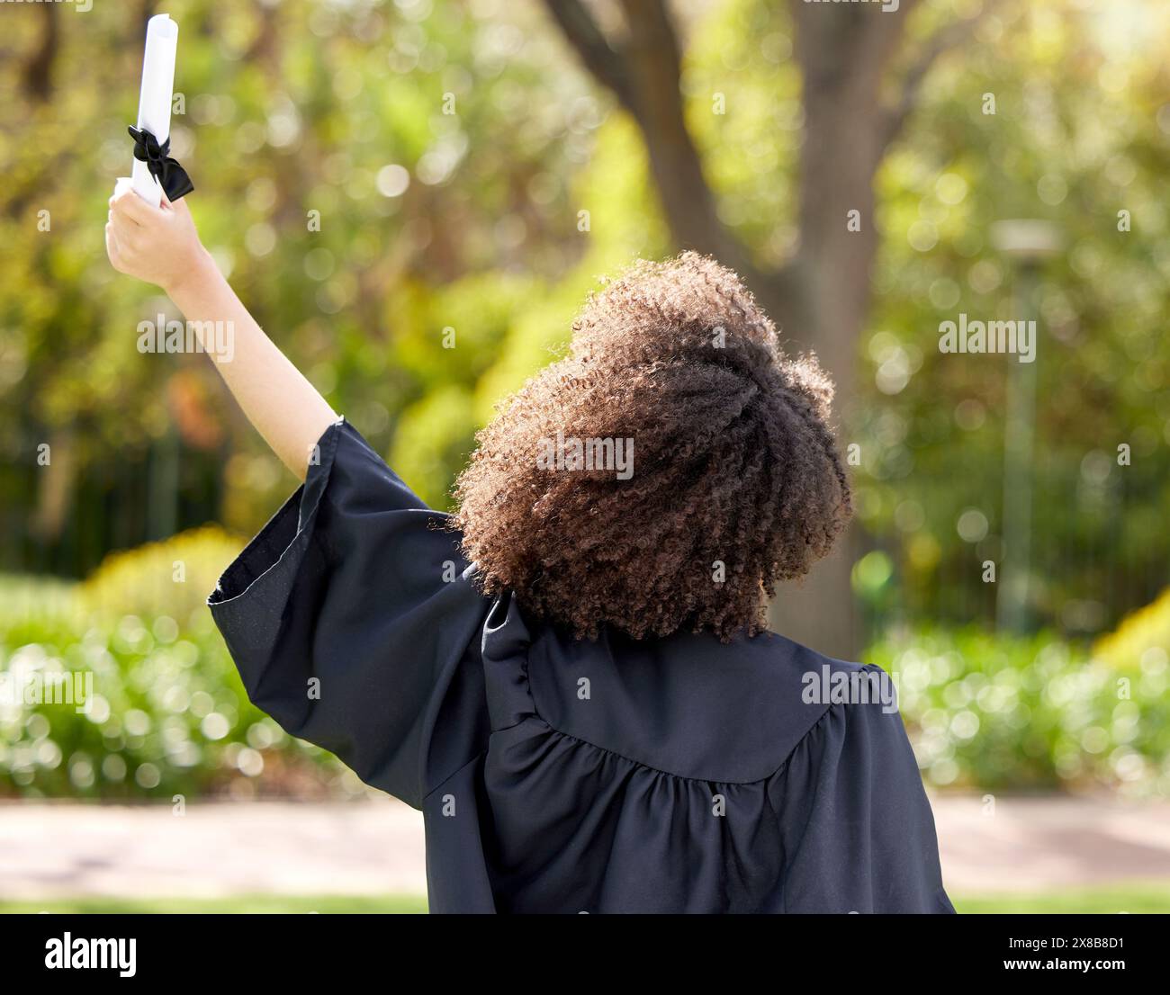 Back, education and freedom with college graduate at university ...