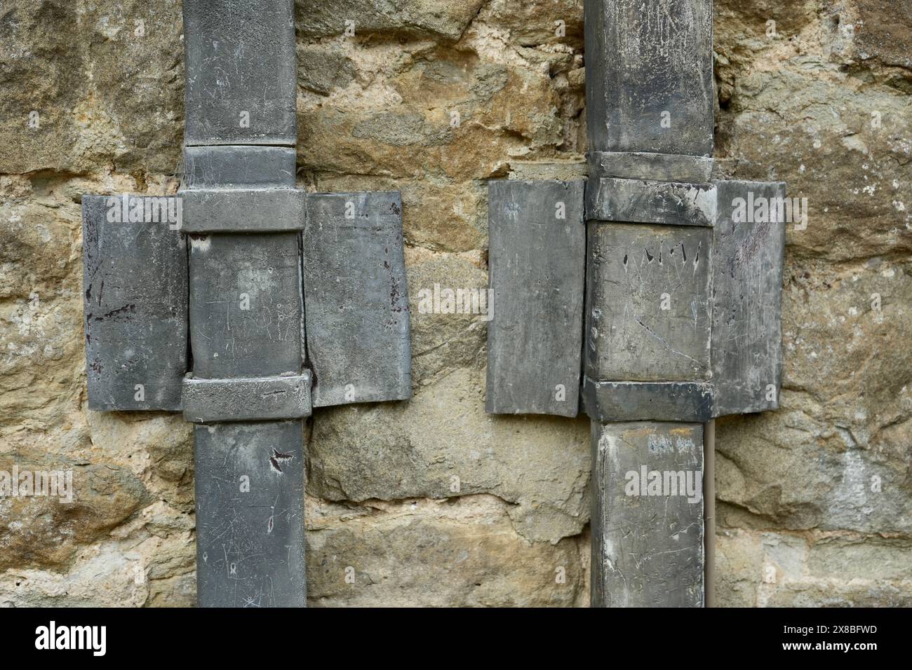 Ancient lead downpipes on a stone wall, England, UK Stock Photo - Alamy