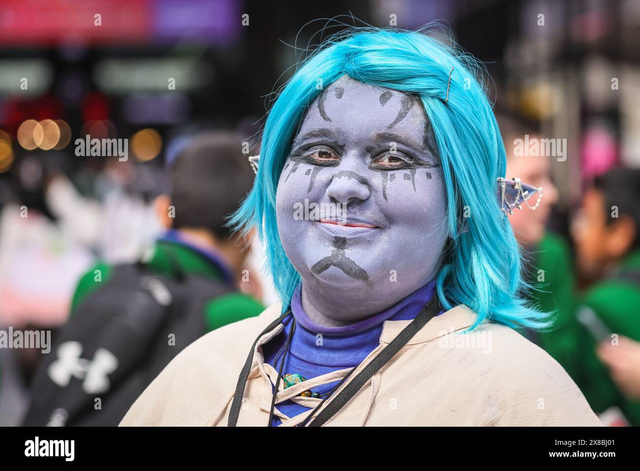 London, UK. 24th May, 2024. A moon elf smiles at the camera ...
