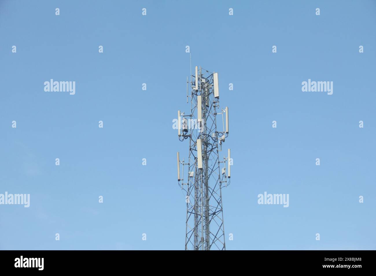 Modern telecommunication tower is standing tall hi-res stock ...