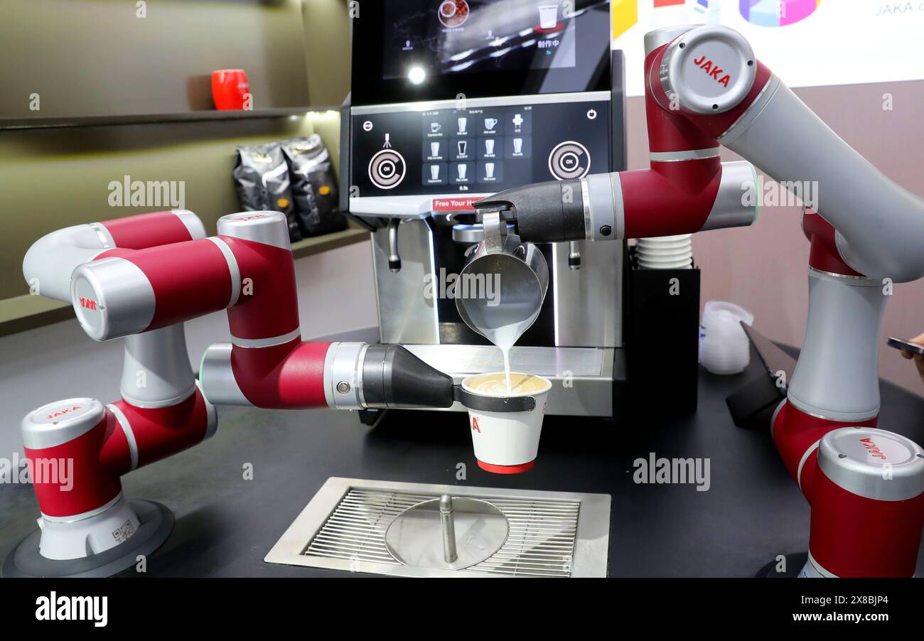 Shanghai. 24th May, 2024. A robot demonstrates coffee-brewing at an ...