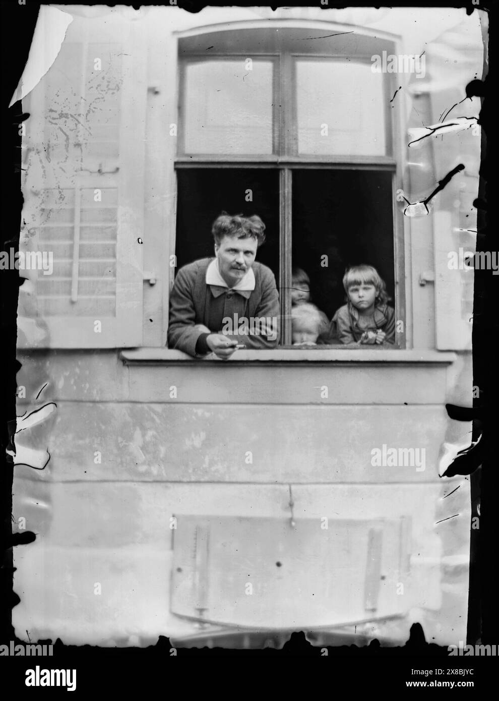 August Strindberg with his children Karin, Greta and Hans in a window ...