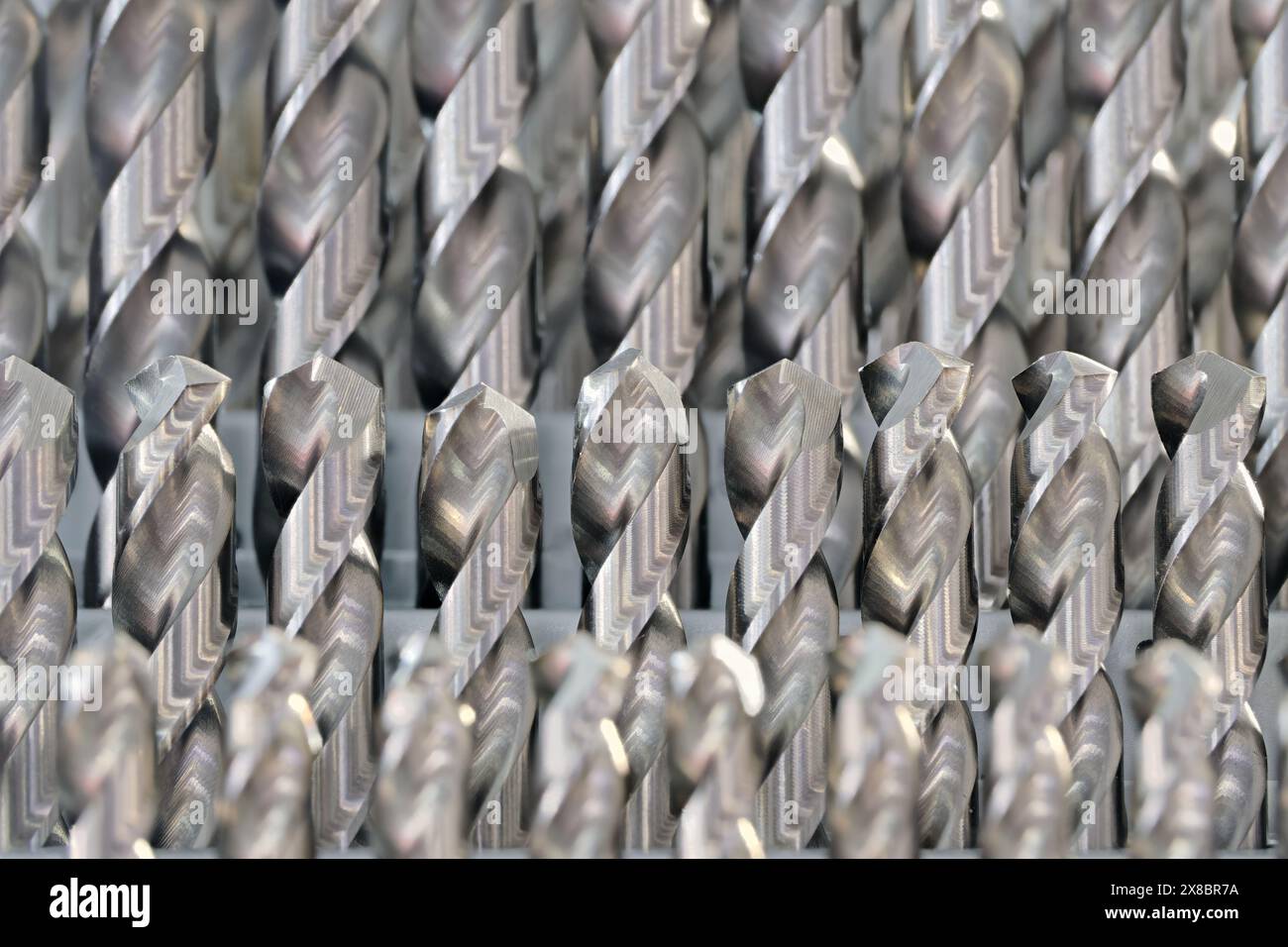 Big group of twist drilling bits, metalworking tools. Close up shot ...