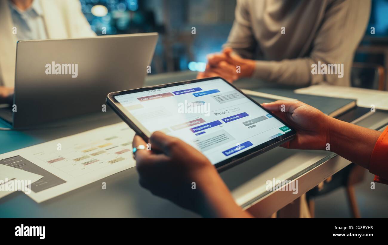 Positive Group of Managers Having a Team Meeting Long After Work Hours ...