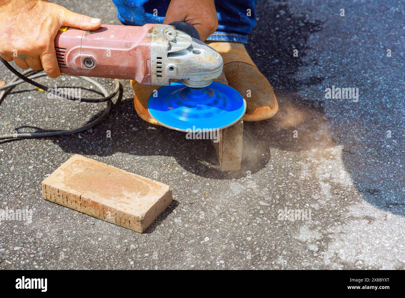 Master grind is performed using circular diamond disc saw before paving ...