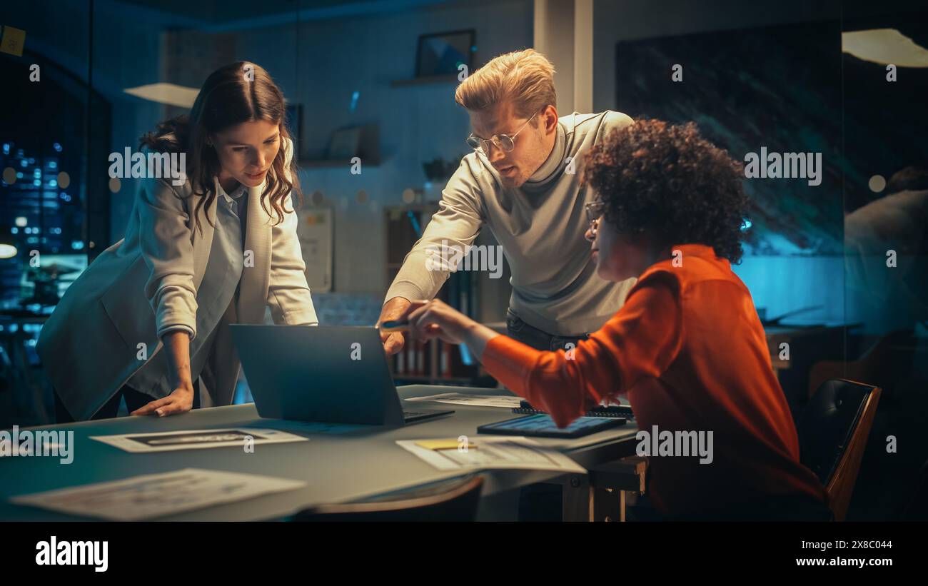 Positive Group of Managers Having a Team Meeting Long After Work Hours ...