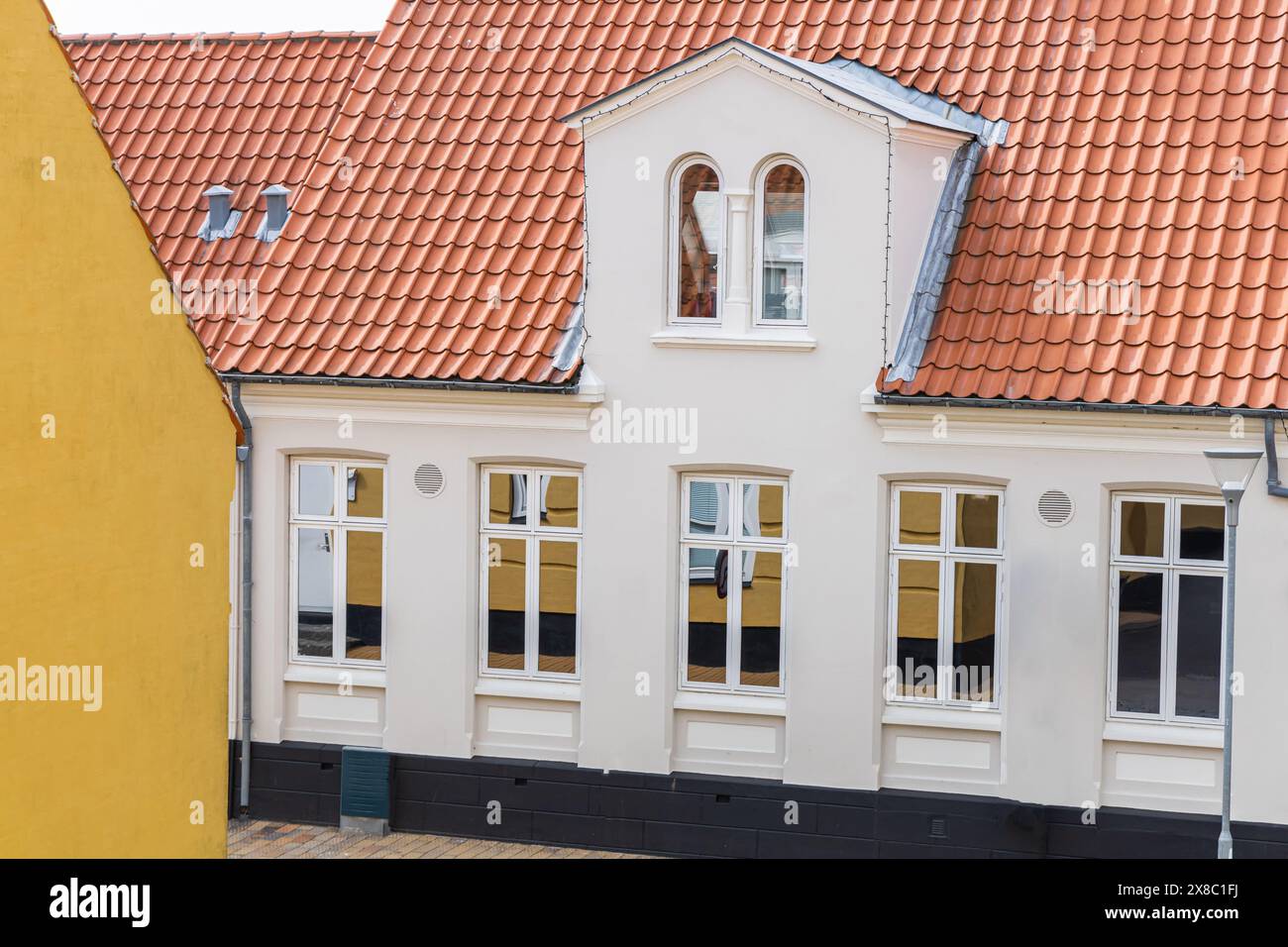 Beautiful old white house with tiled roof Stock Photo - Alamy