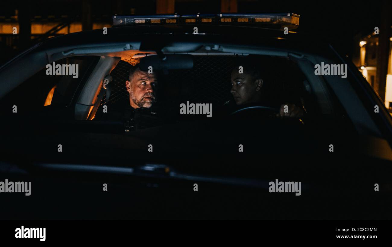 Two Multiethnic Police Officers Discussing While Waiting in the Car ...