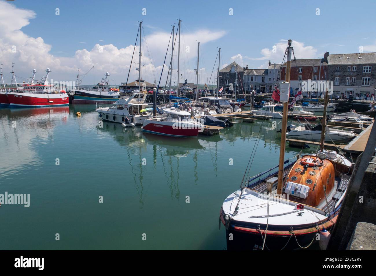 Boats moored at the harbour in Padstow, Cornwall. The fishing village ...