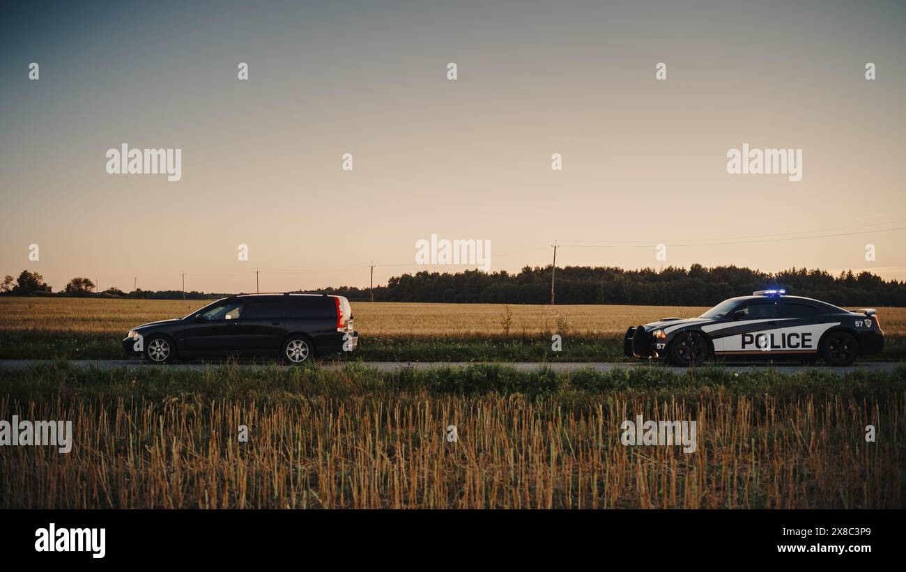 Speeding Driver Gets Pulled Over By Police Patrolling Car . Wide Shot ...