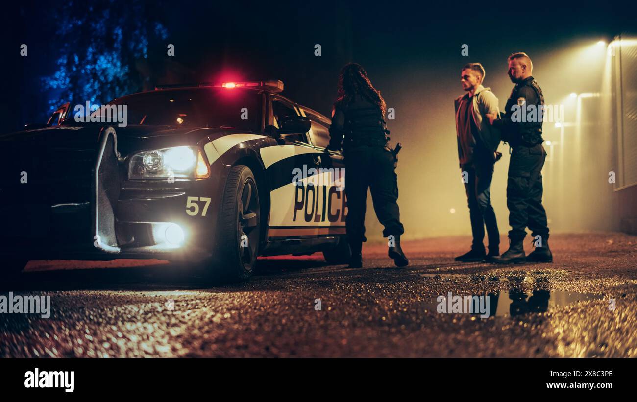 Policeman arresting woman hi-res stock photography and images - Alamy