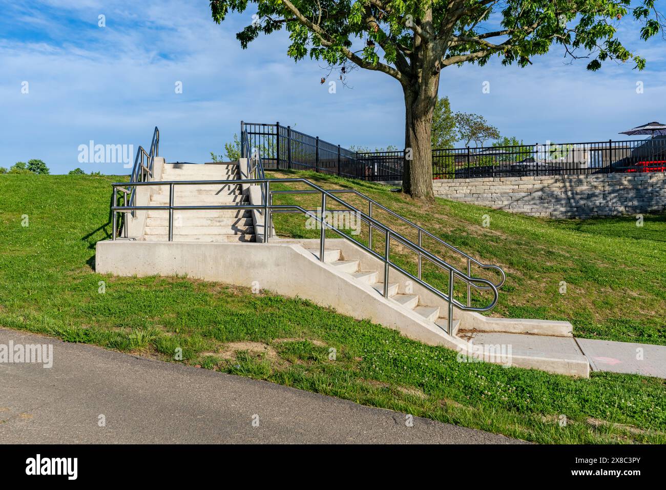 Example of a stainless steel railing along an exterior set of stairs at ...