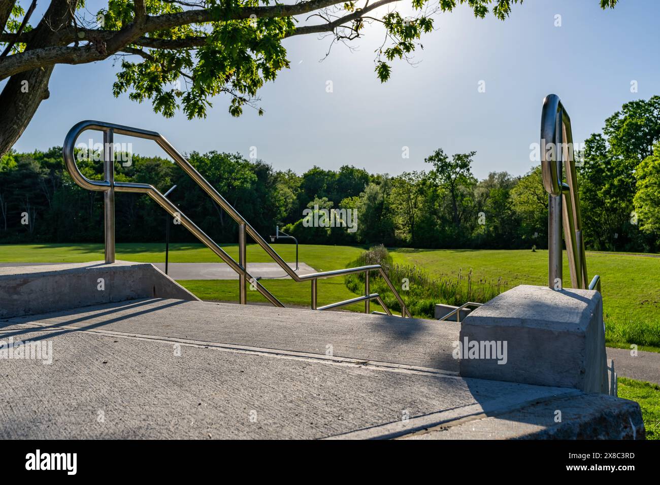 Example of a stainless steel railing along an exterior set of stairs at ...