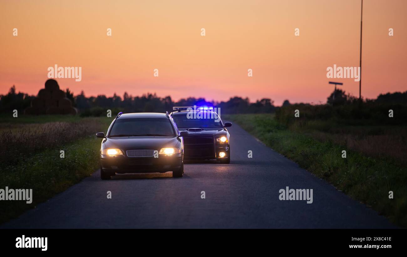 Speeding Driver Gets Pulled Over By Police Patrolling Car . Wide Shot ...