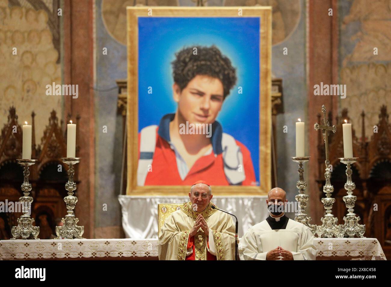 FILE - An image of 15-year-old Carlo Acutis, an Italian boy who died in ...