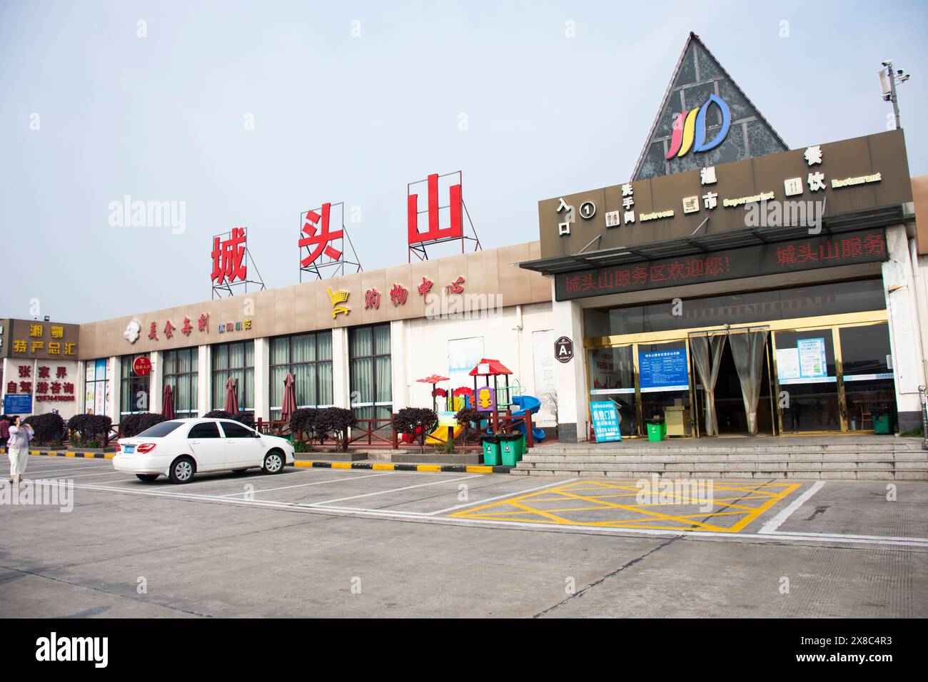 Chinese people and foreign travelers driving stop vehicle rest relax ...