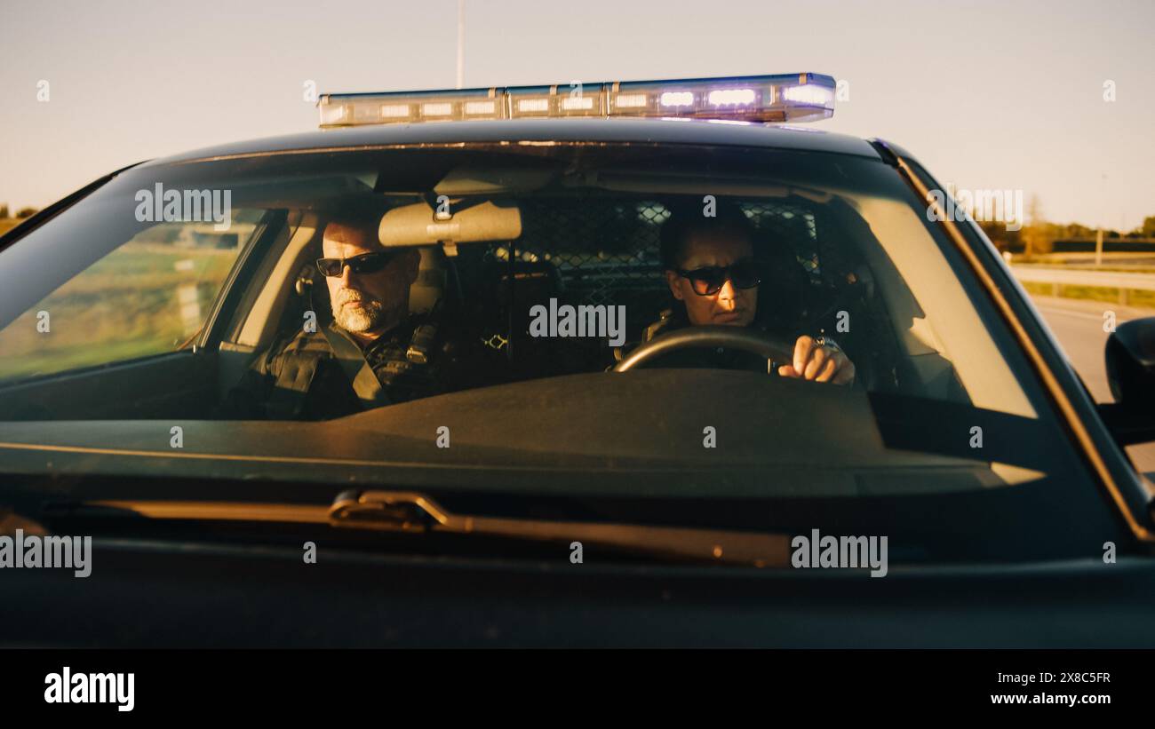 Police car patroling hi-res stock photography and images - Alamy