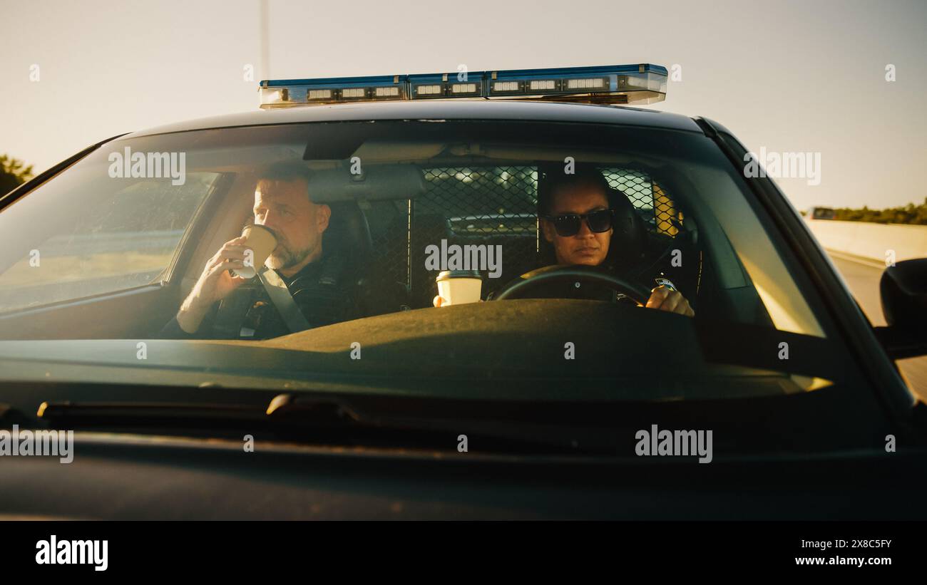 Point of View: Two Police Officers Driving Traffic Patrol Car, Drink ...