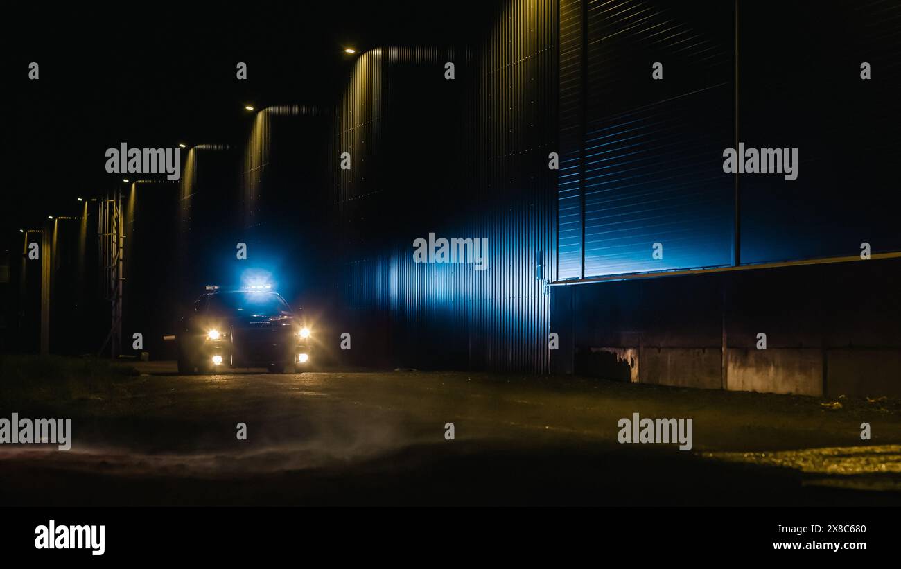 Police Officers in Patrol Car Cruising Seedy Streets of a City Ready to ...