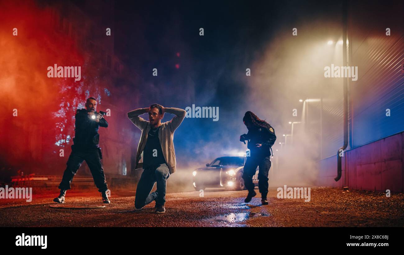 Two Multiethnic Police Officers Aim at a Suspect. Police Using a Weapon ...