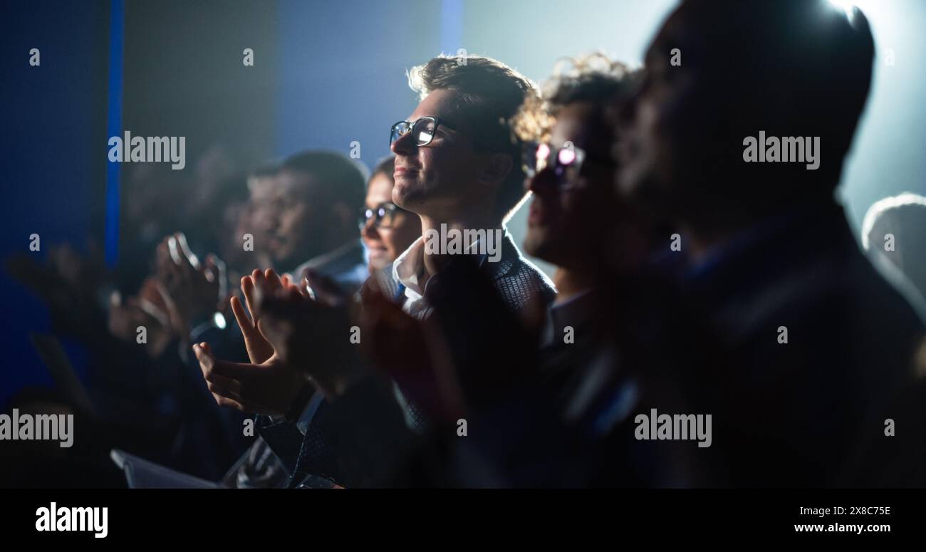 Young Man Sitting in a Crowded Audience at a Business Conference. Male ...