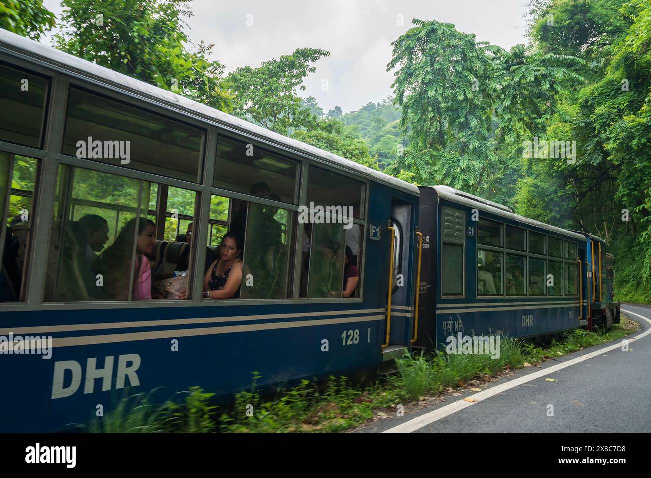 Darjeeling,West Bengal,India - 10th August 2023 : Diesel Toy train passing through Himalayan ...
