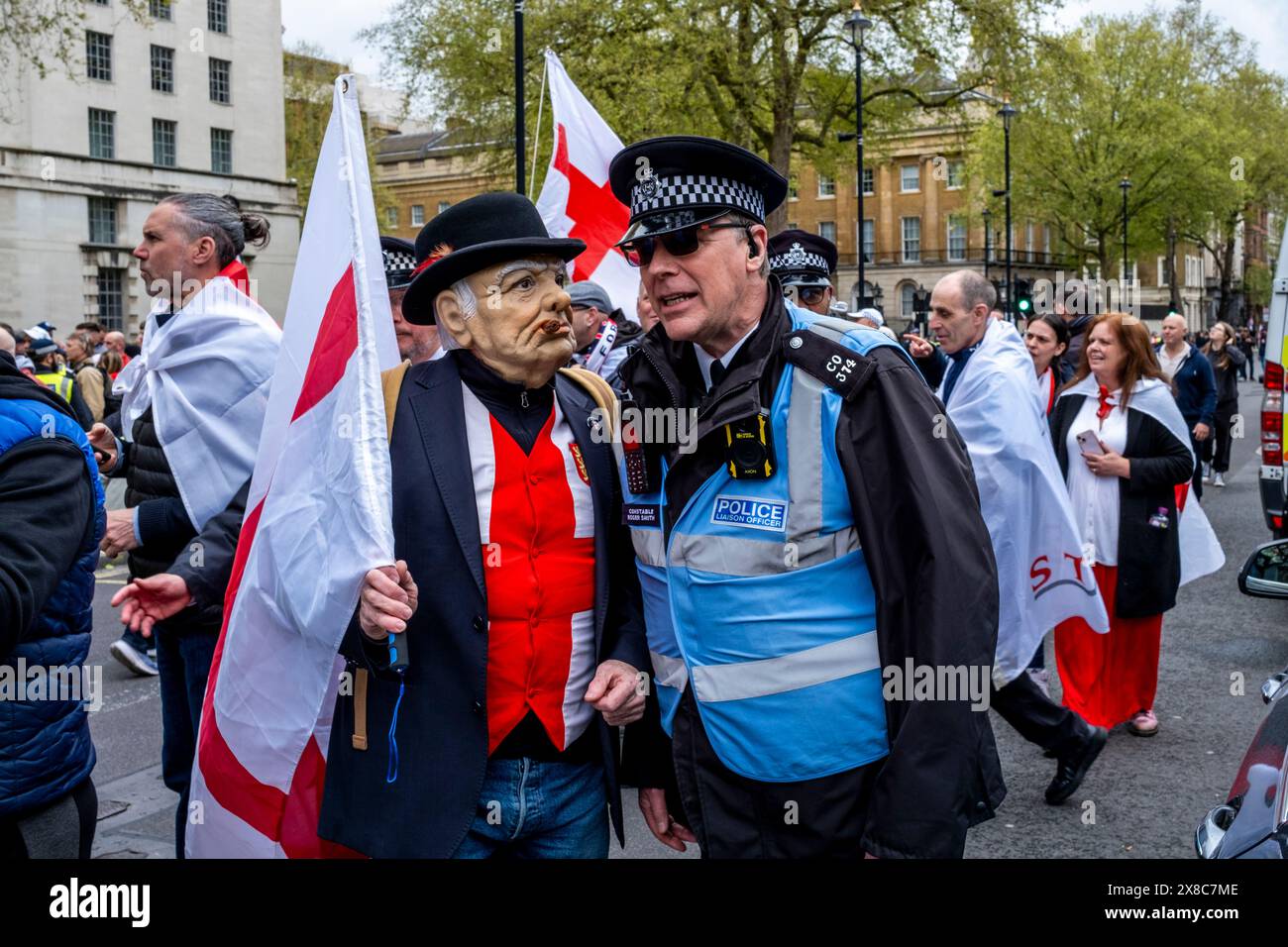 A Man Wearing A Winston Churchill Costume Talks To A Police Officer ...