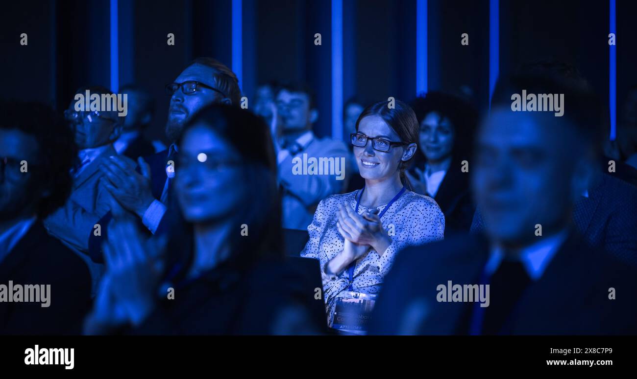 Young Woman Sitting in a Crowded Audience at a Business Conference ...