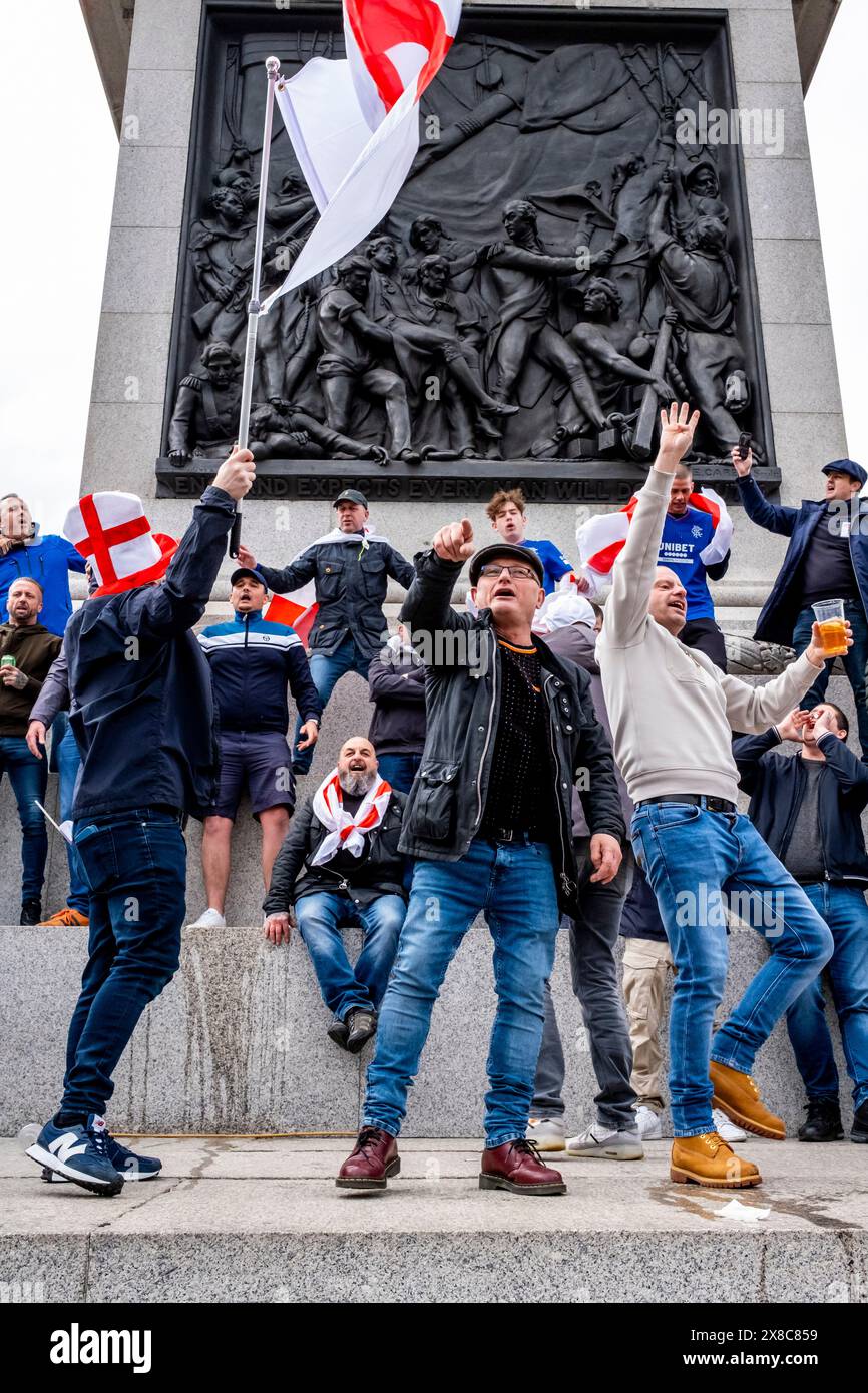 A Group of People Singing 'Ten German Bombers' In Trafalgar Square ...