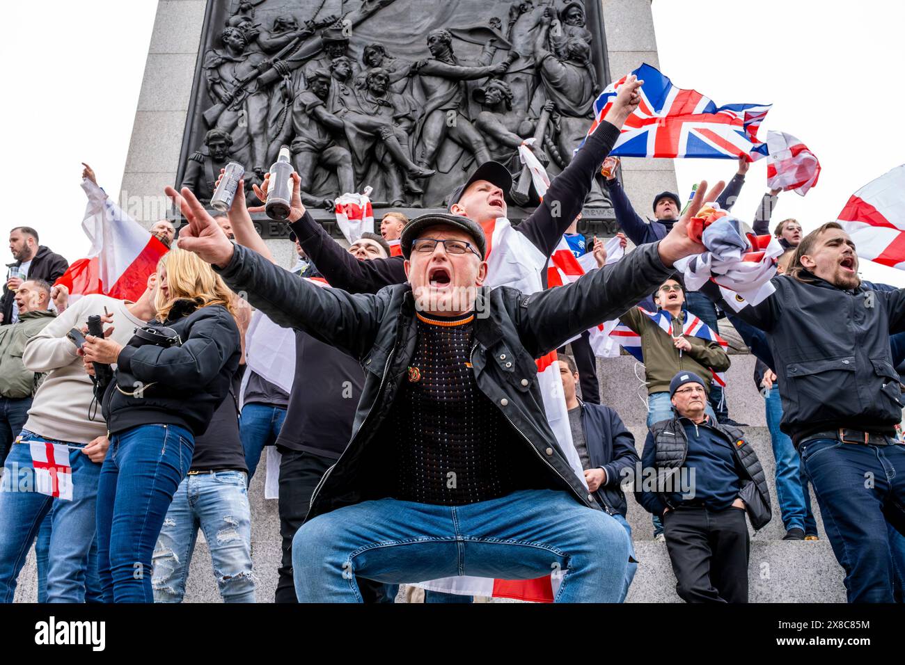 A Group of English People Singing In Trafalgar Square During St George ...