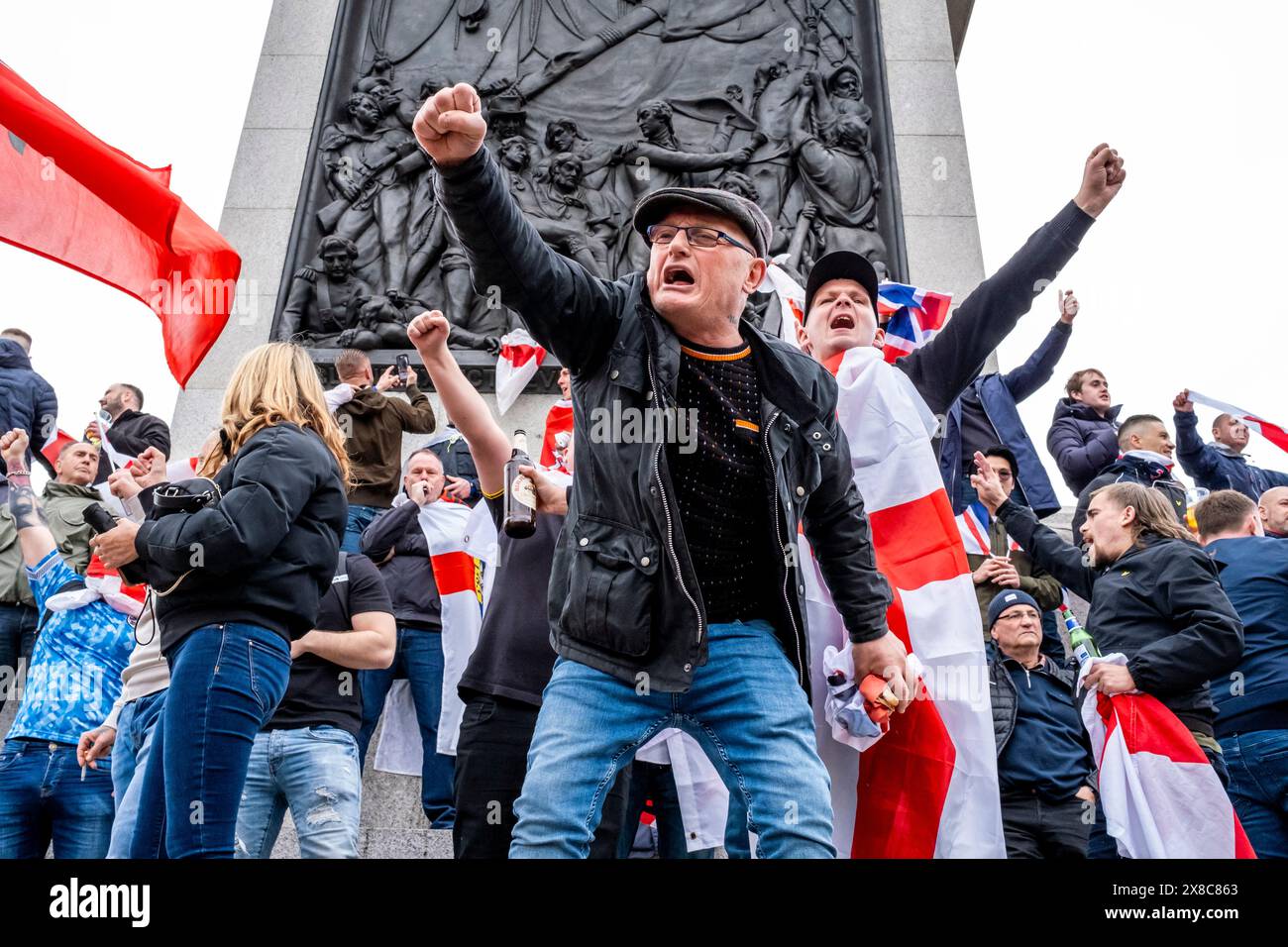 A Group of English People Singing In Trafalgar Square During St George ...