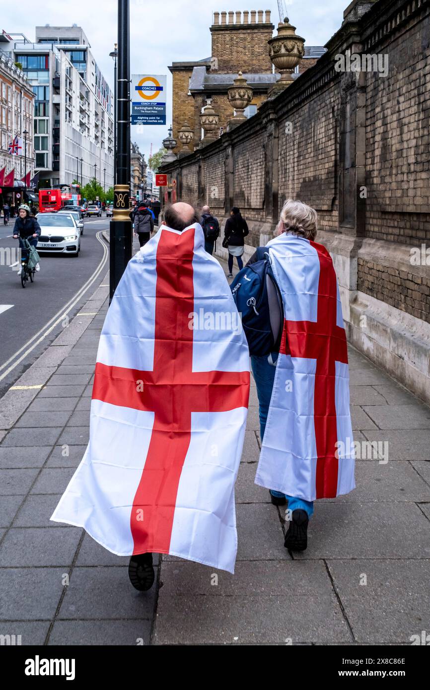 A Middle Aged Couple Wrapped In Cross of St George Flags Walk Towards ...