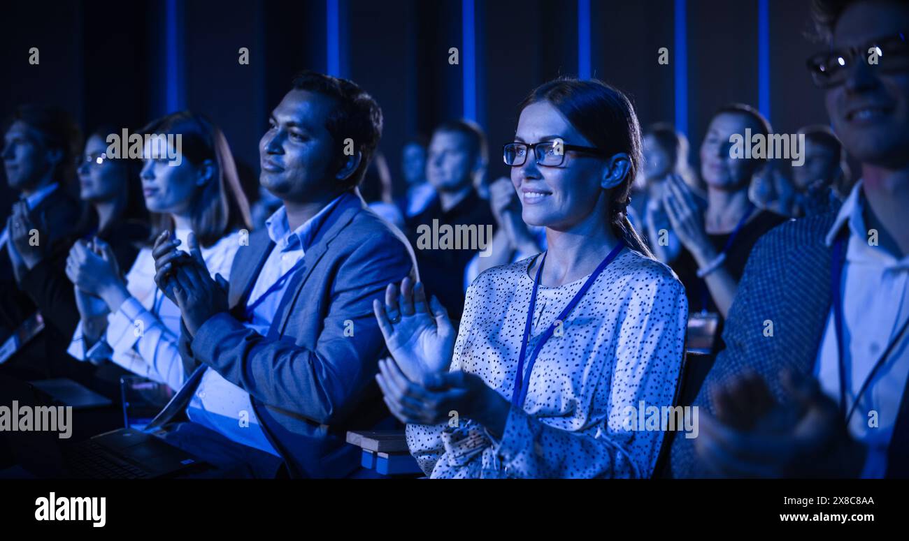 Young Woman Sitting in a Crowded Audience at a Business Conference ...