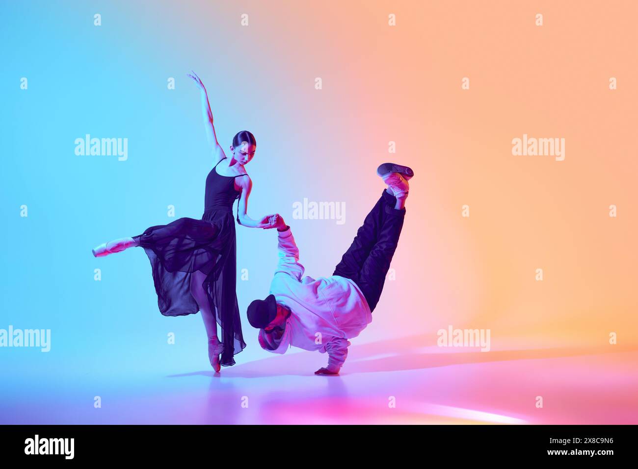 Classical ballerina and a contemporary street dancer making ...