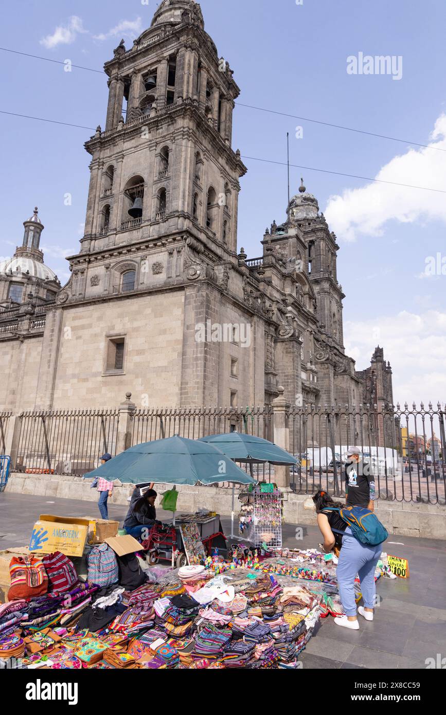 Mexico City street; A woman shopping at a stall in a street market ...