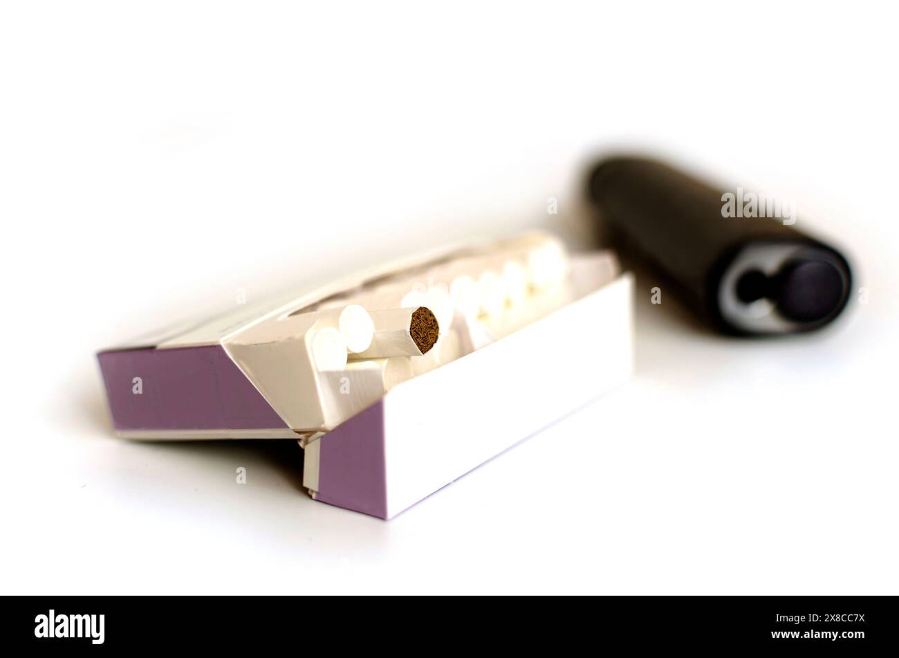 Stick cigarettes and tobacco heating system on a light gray background ...