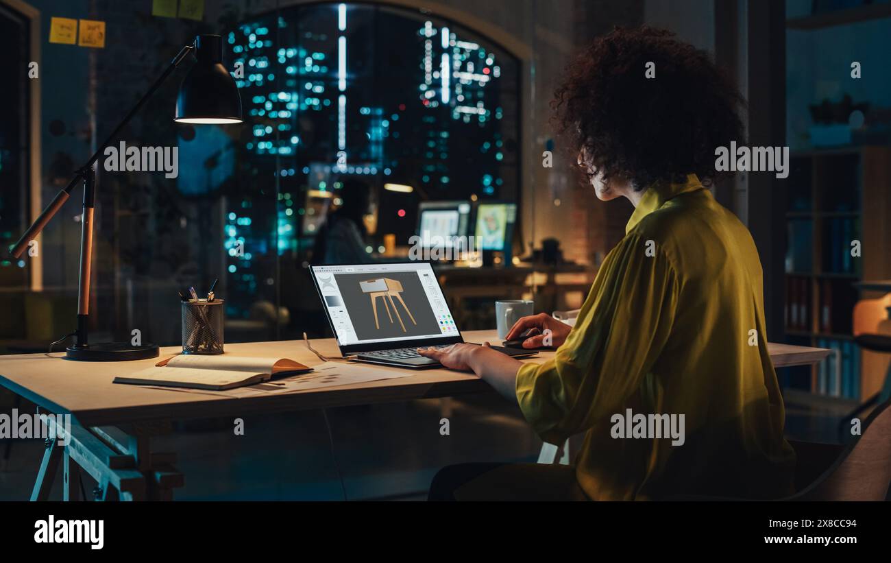 Creative Multiethnic Female Working on Laptop Computer with an Interior ...