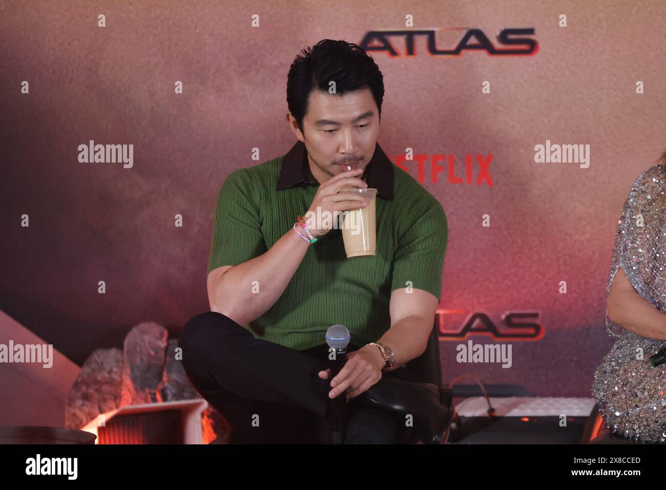 Actor Simu Liu speaking during a press conference to promote the Atlas ...