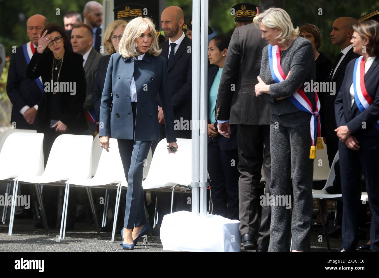 Brigitte Macron and Marine Le Pen during a military funeral ceremony at ...