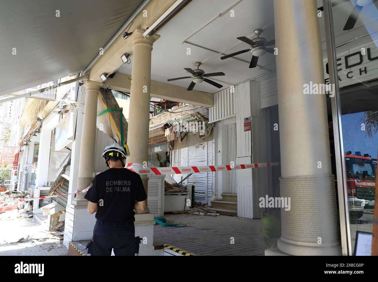 24 May 2024, Spain, Palma: Firefighters work on the Medusa Beach Club ...