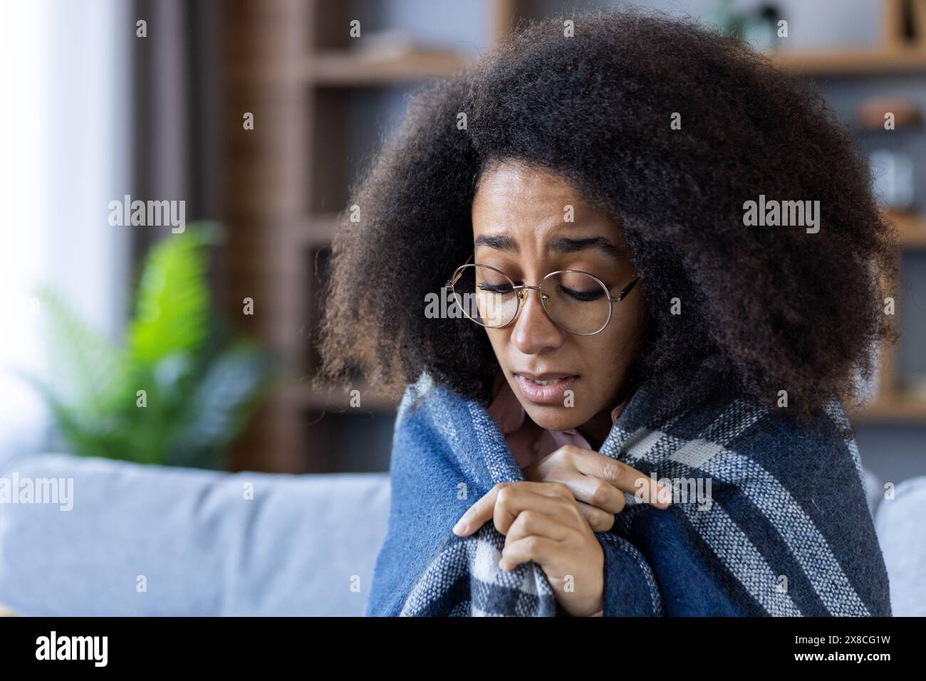Depressed woman wrapped in hi-res stock photography and images - Alamy
