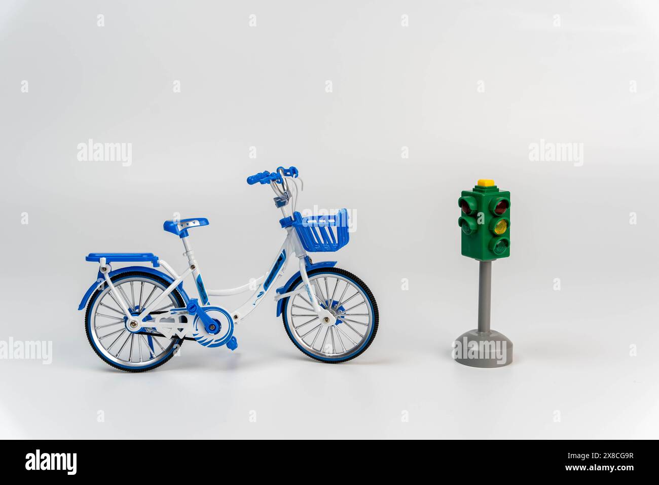 Miniature bike placed next to a working traffic signal Stock Photo - Alamy